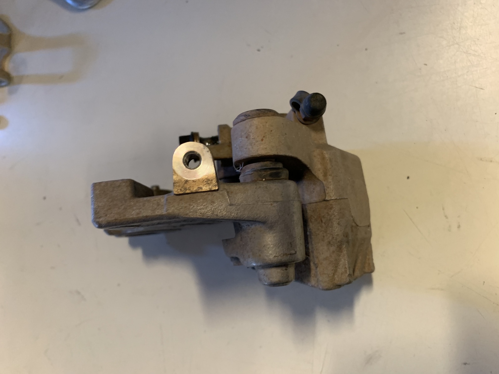 HONDA XR 400 REAR BRAKE CALIPER AND MOUNTING BRACKET
